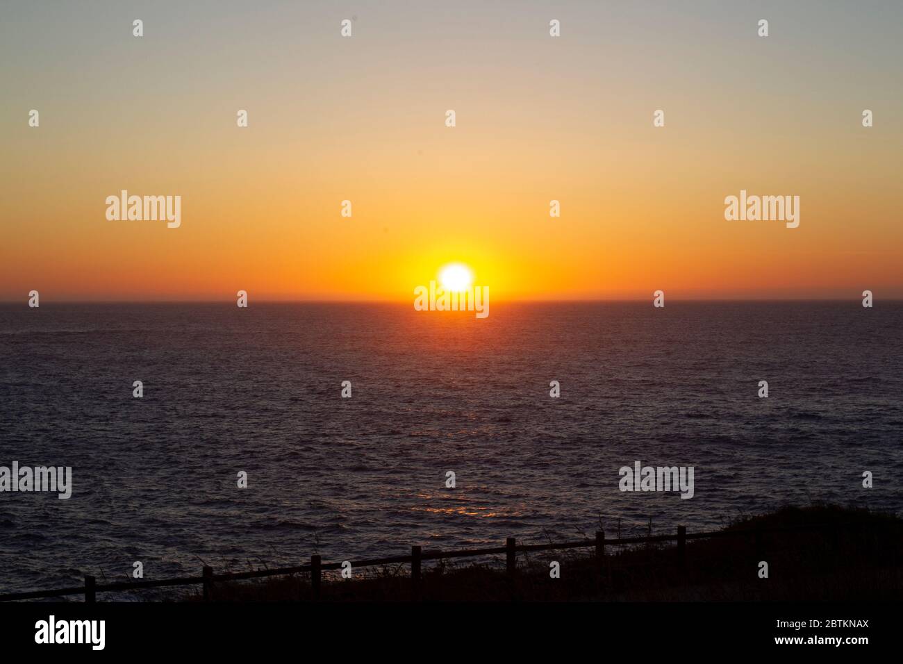 sunset with the sun reflecting in the sea Stock Photo - Alamy