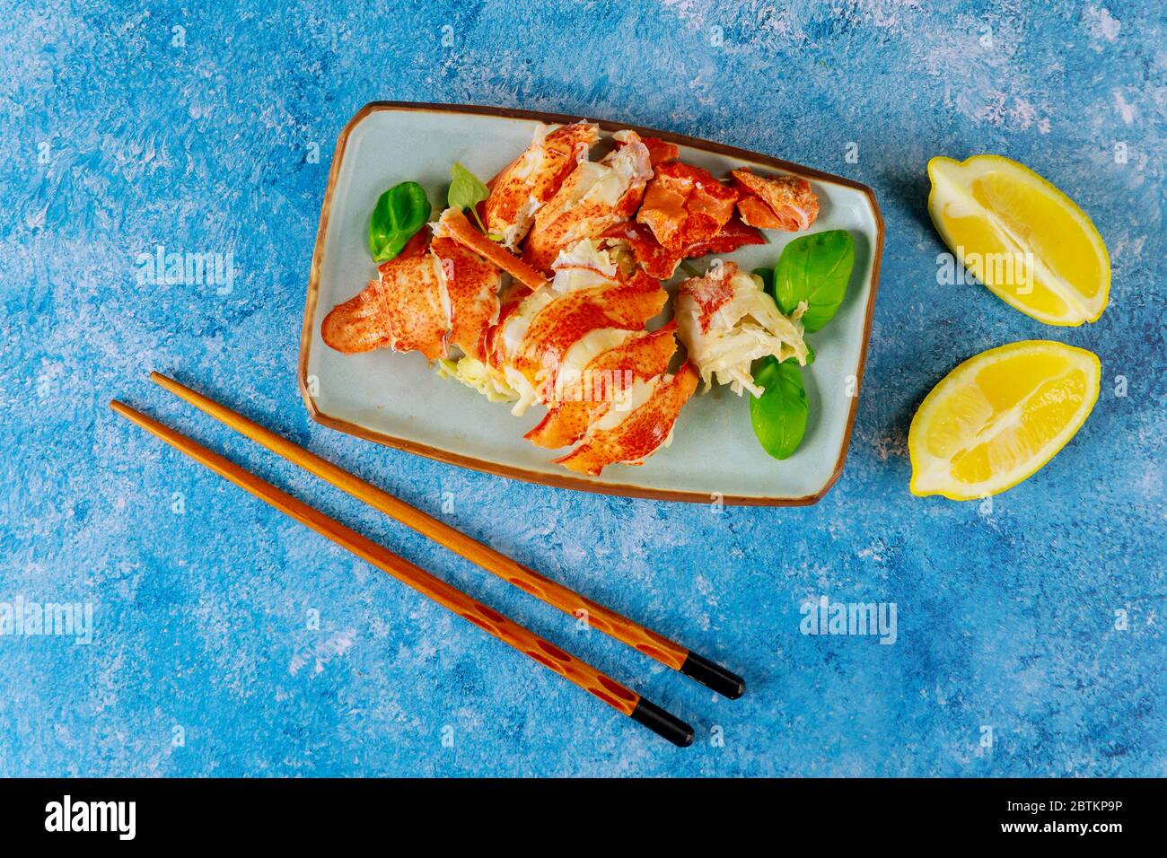 Delicious cooked lobster meat in a bowl with lemon on dinner Stock ...