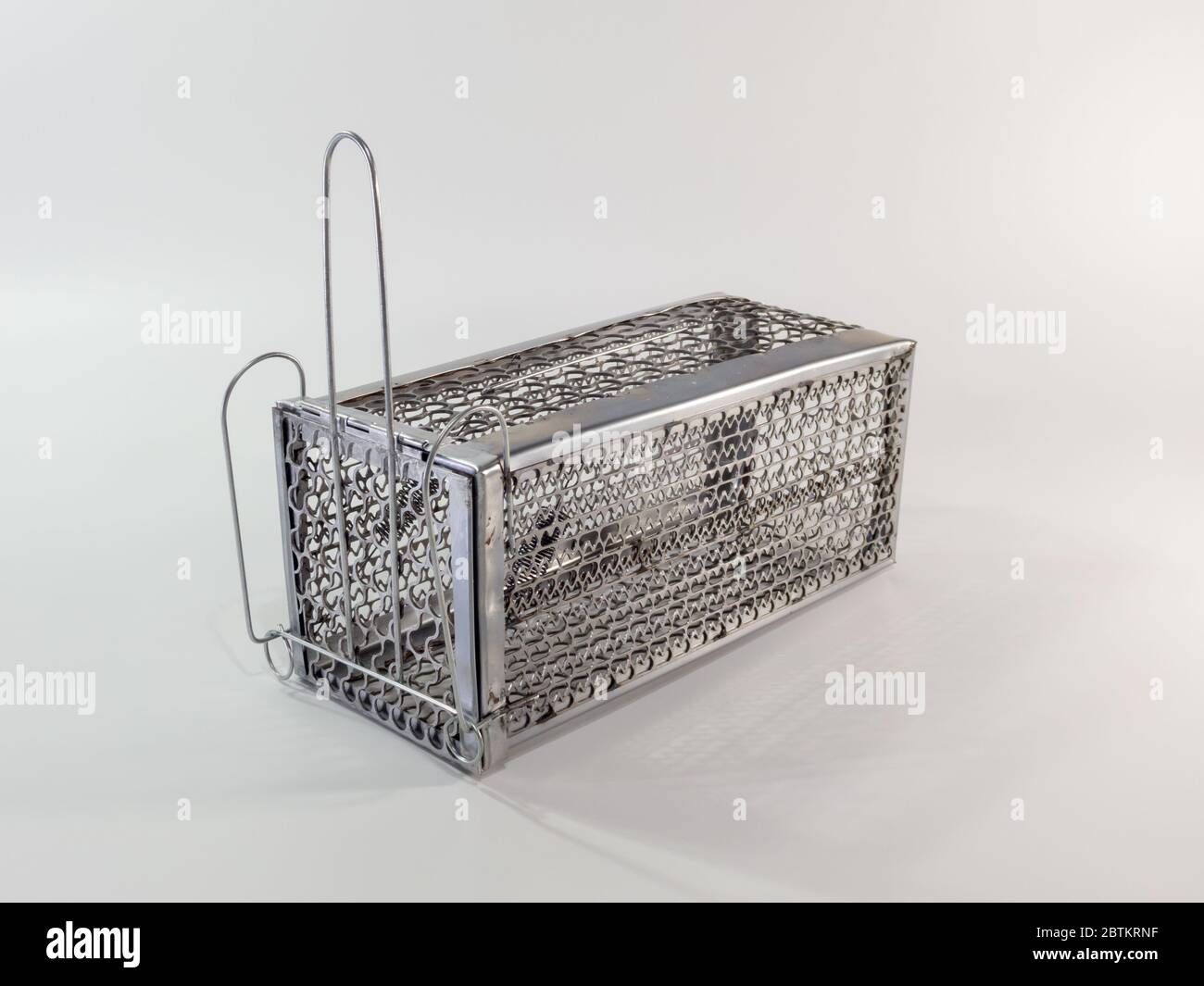Cage mouse trap on white background Stock Photo - Alamy