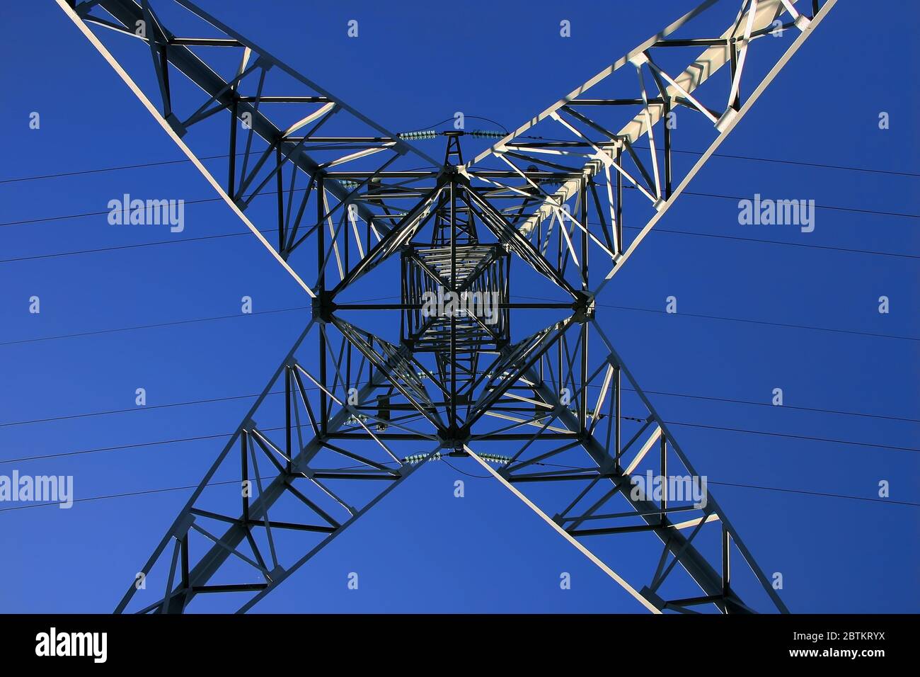 Detailed view of high voltage powerline tower construction, electric ...