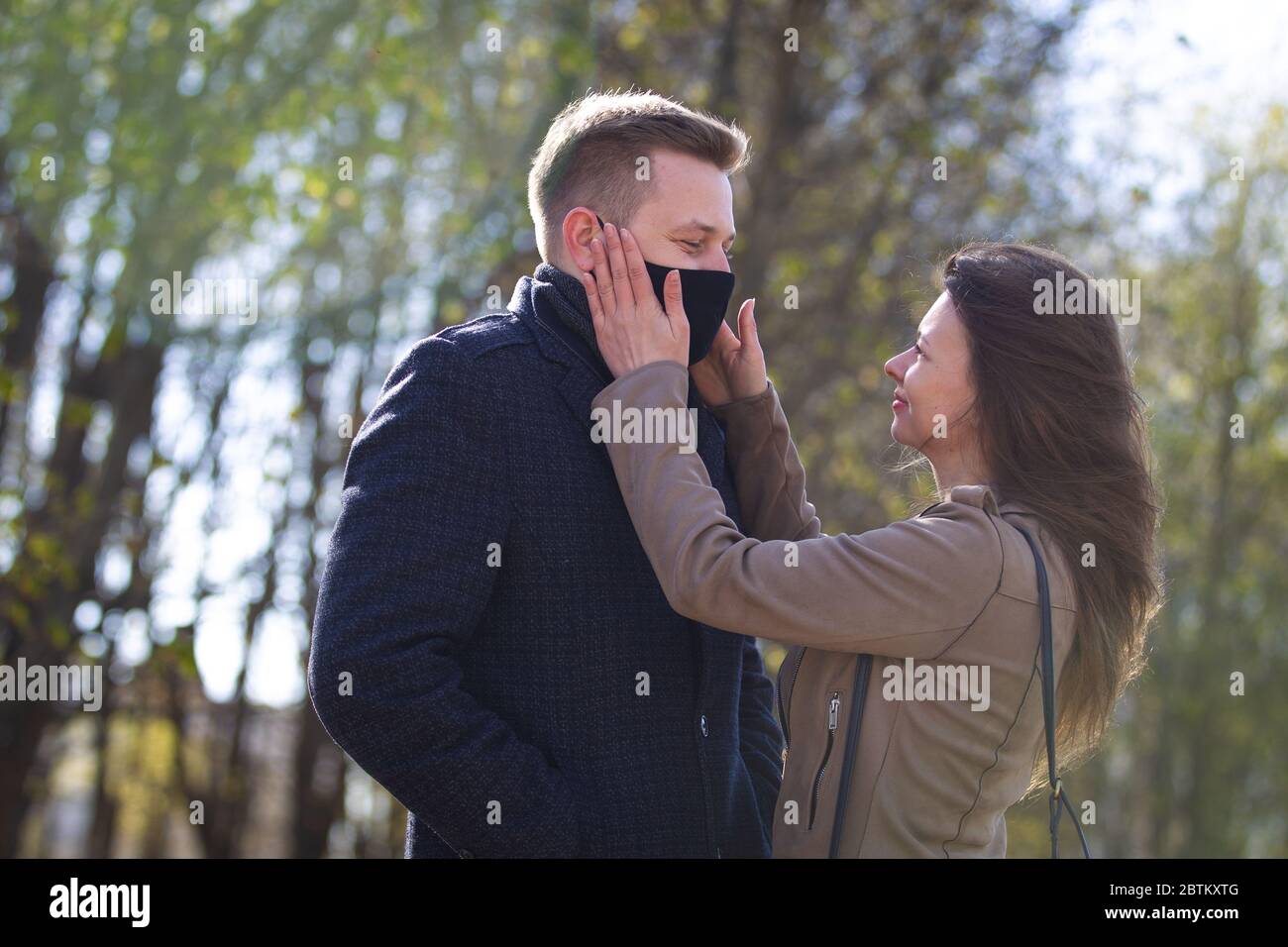 Couple walking in park protective hi-res stock photography and images ...