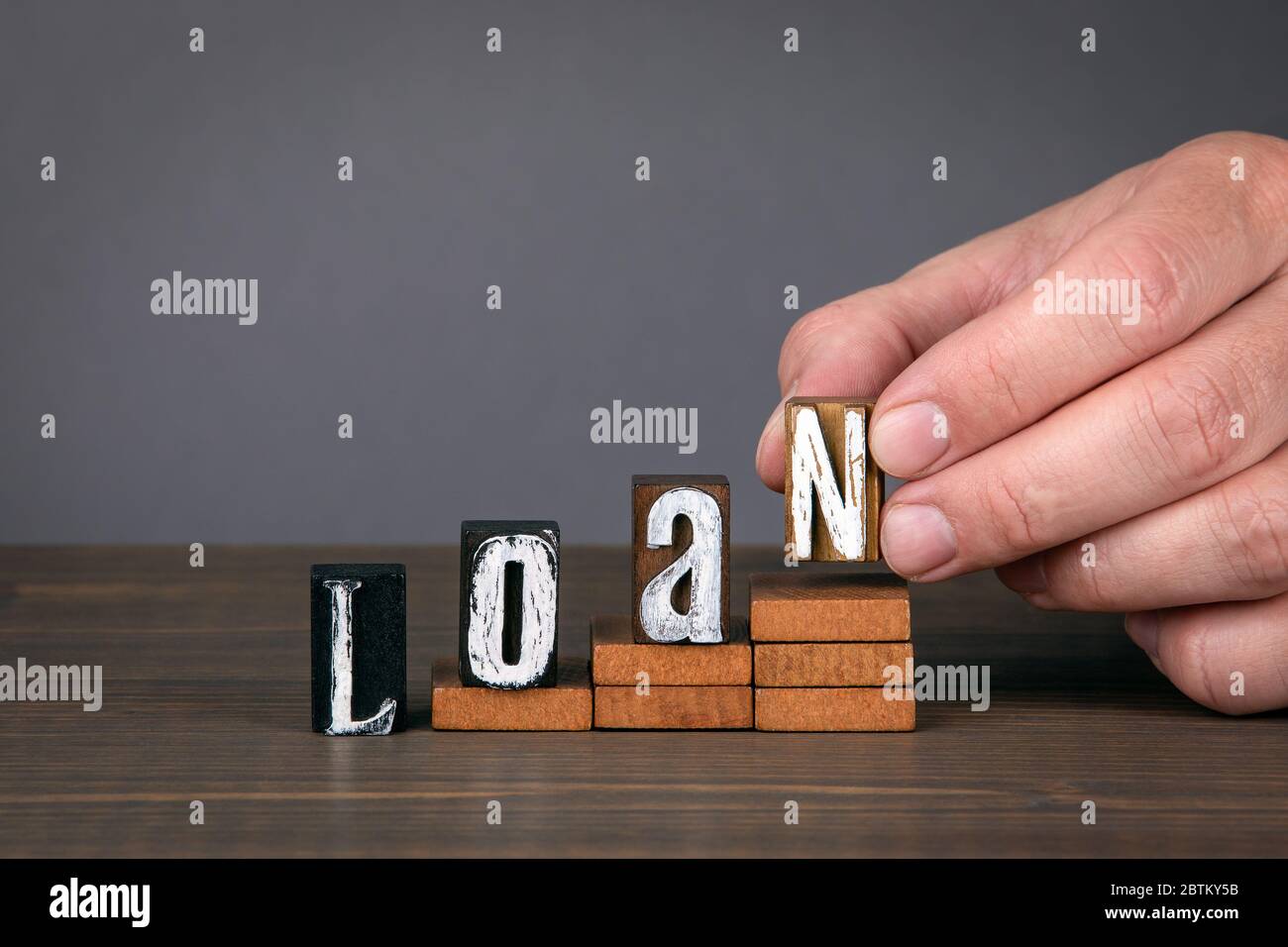 LOAN. Transaction, approved, debt and liabilities concept. Wooden ...