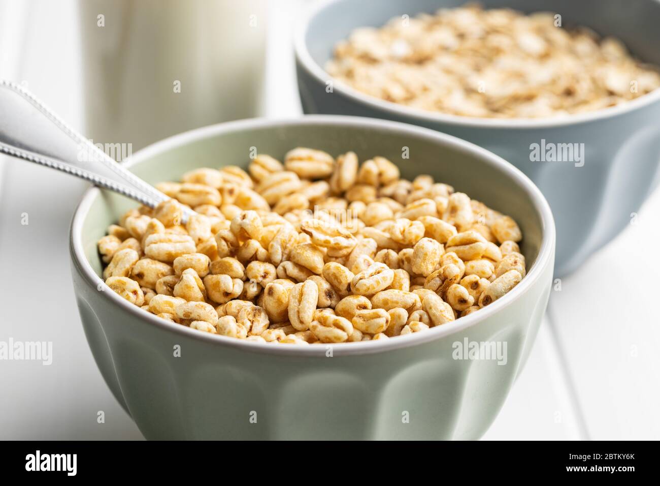 Puffed wheat covered with honey in bowl Stock Photo - Alamy