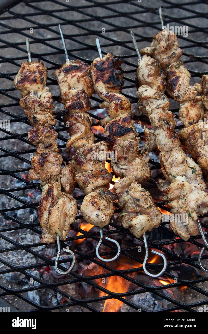 Healthy chicken kebab. Barbecue chicken meat on skewers outdoor. View ...