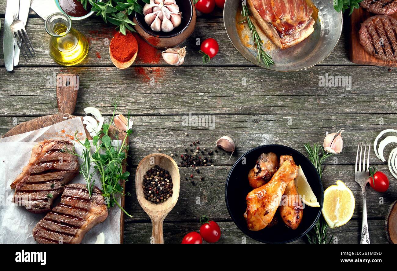 Different types of Grilled meat on rustic wooden table. Top view Stock ...