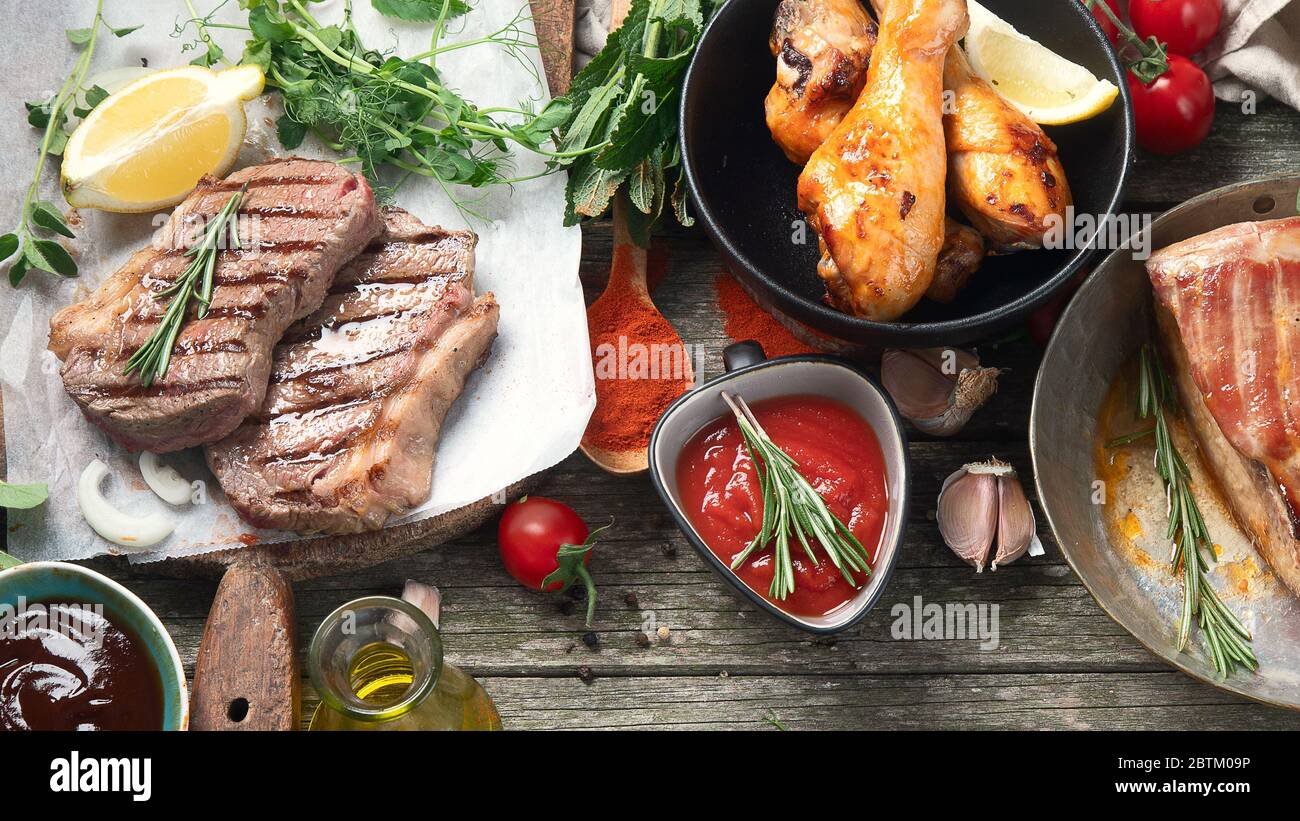 Different types of Grilled meat on rustic wooden table. Top view Stock ...