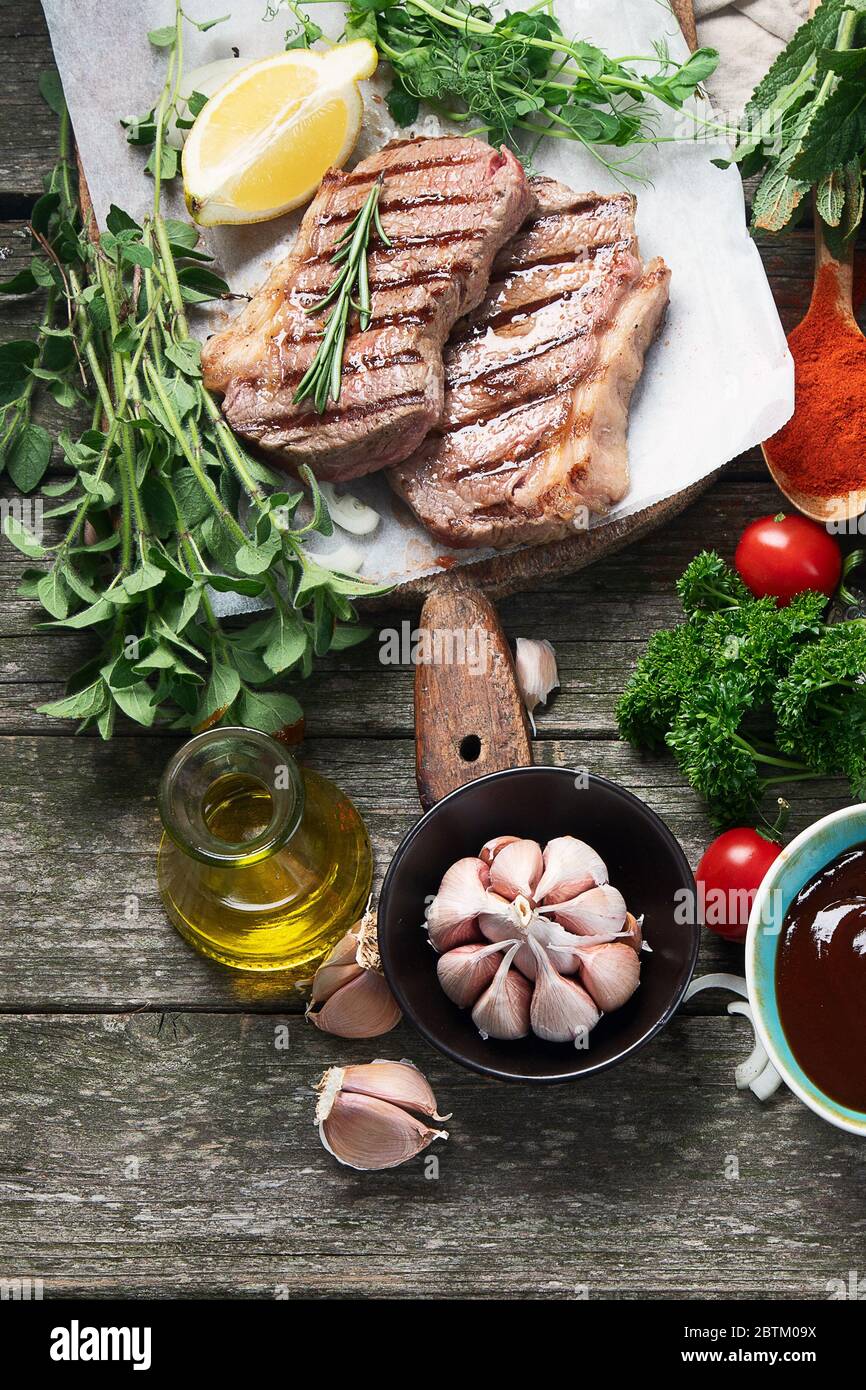Different types of Grilled meat on rustic wooden table. Top view Stock ...