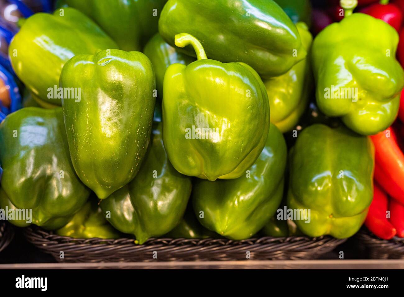 Vegetables peppers in the store Stock Photo - Alamy