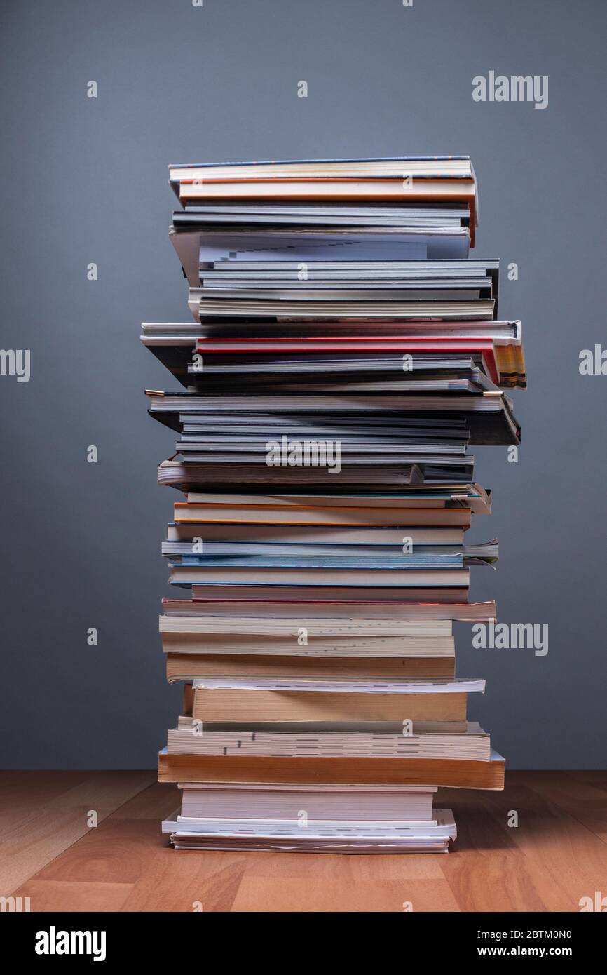 Mountain of books representing the information Stock Photo - Alamy