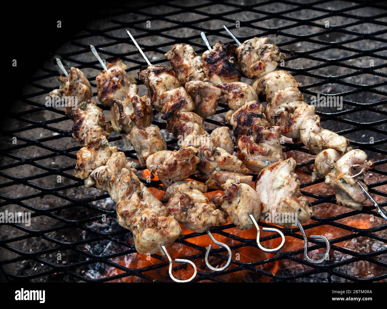 Healthy chicken kebab. Barbecue chicken meat on skewers outdoor. View ...