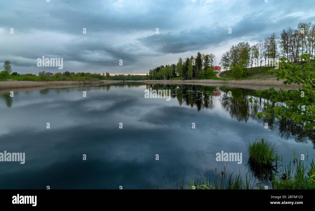 colorful spring landscape with beautiful sky, clouds and tree ...