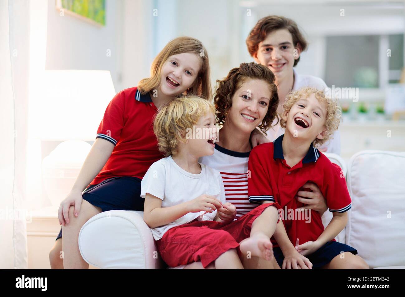 Mother and kids at home. Happy family with children. Mom and four ...