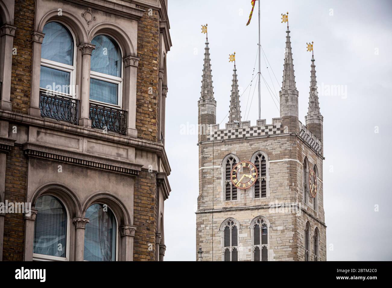 The Tower of Southwark Cathedral, alongside another nearby building, in ...