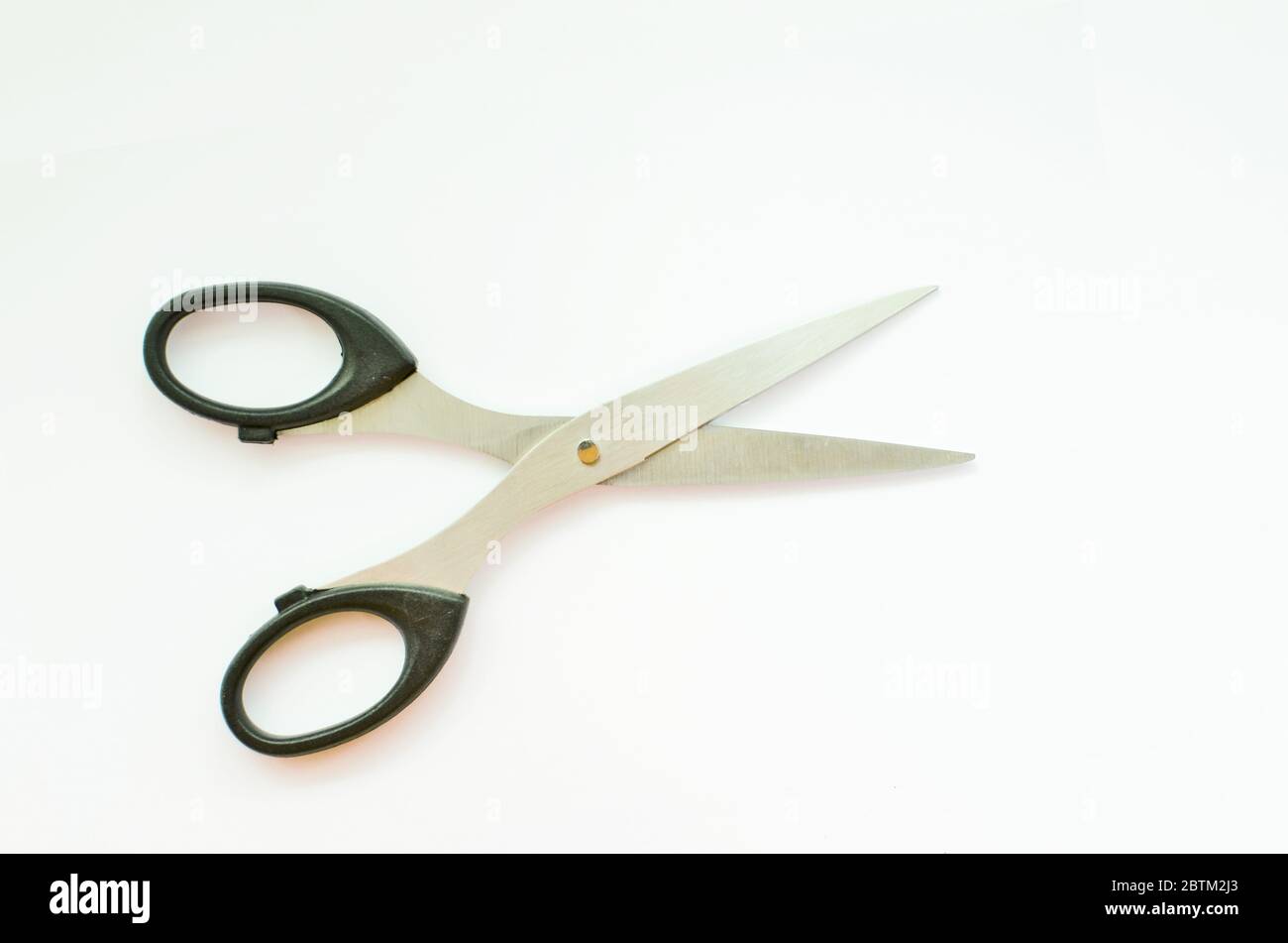 Scissors isolated on a white studio background Stock Photo - Alamy