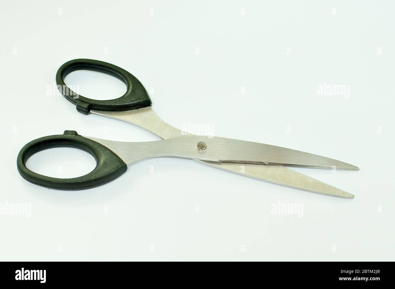 Scissors isolated on a white studio background Stock Photo - Alamy