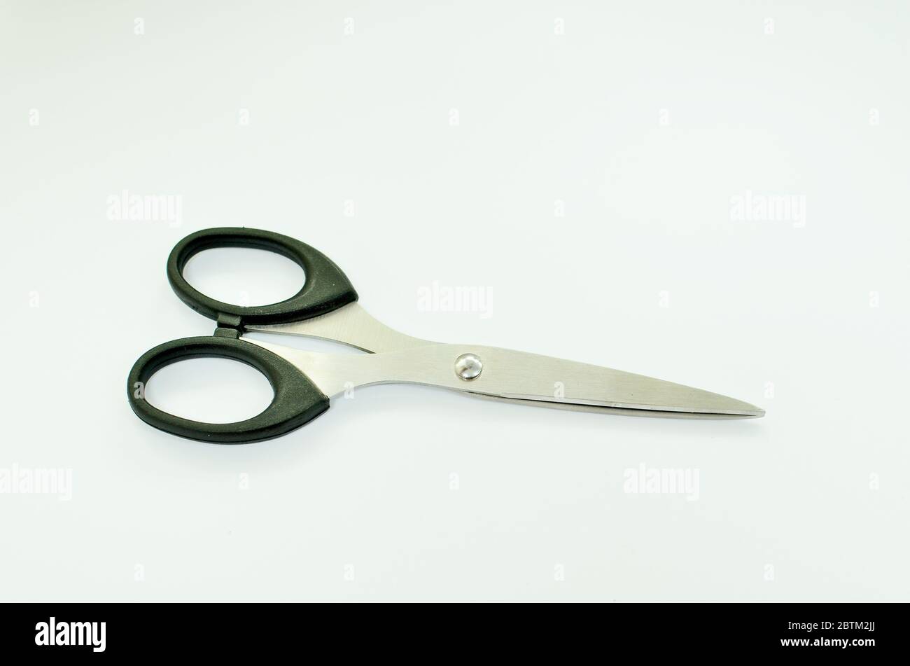 Scissors isolated on a white studio background Stock Photo - Alamy