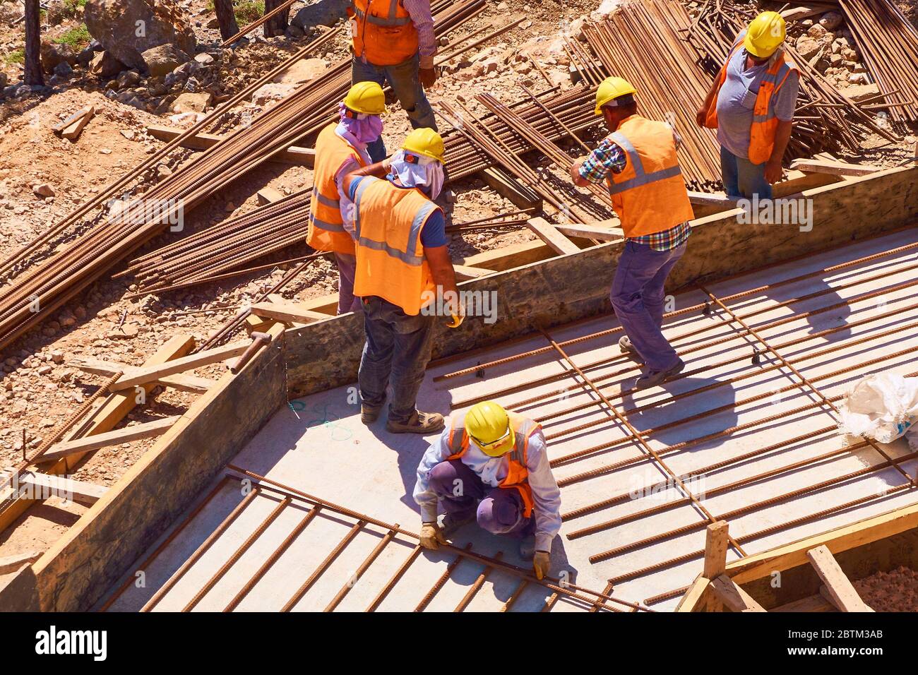 Workers are building concrete reinforced foundation plate at ...