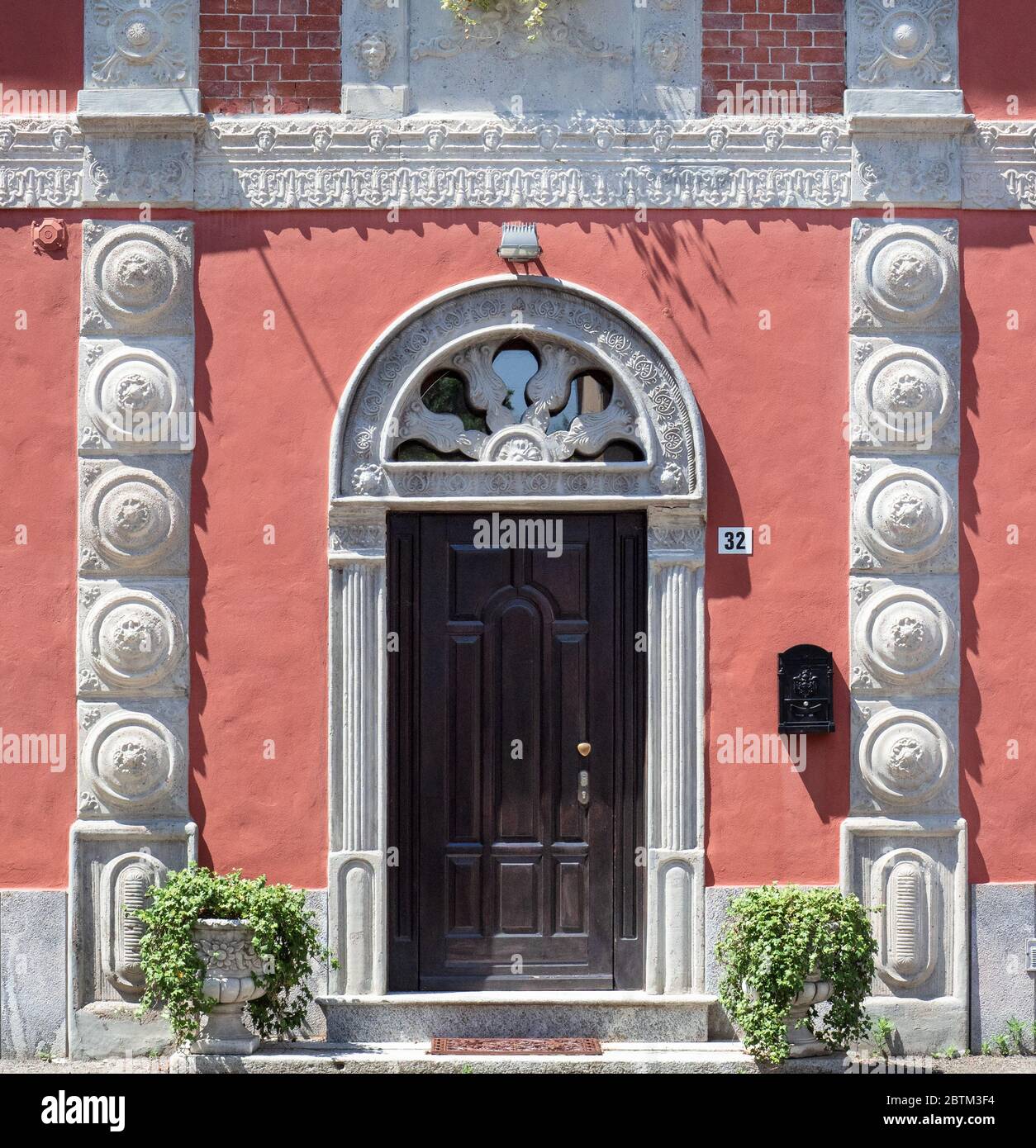 elegant arched door on the facade of a house with elaborate art nouveau ...