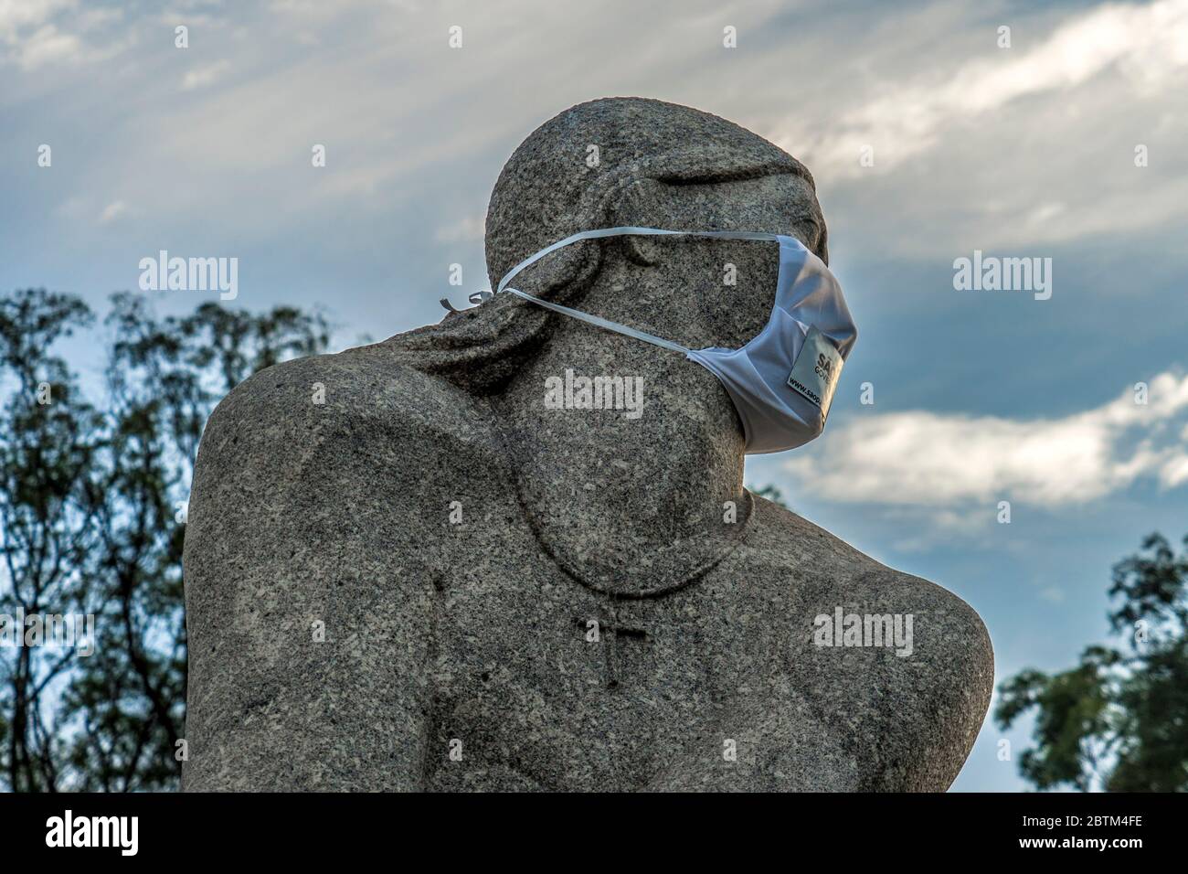 View of the Monument to the Banderias adorned with protective mask ...