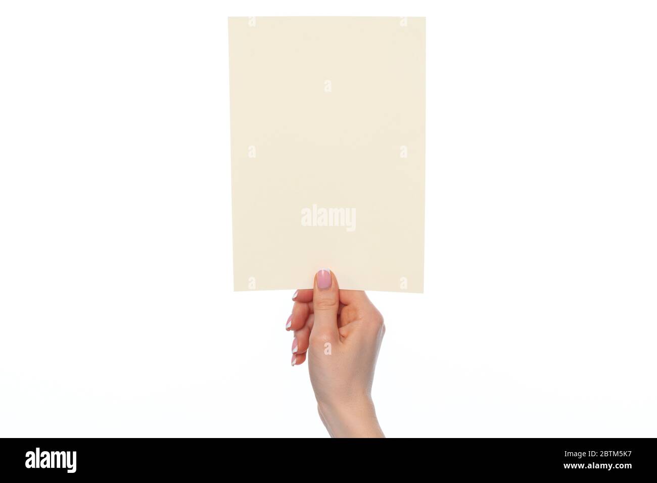 Female hand holding blank white sheet of paper isolated on white Stock ...