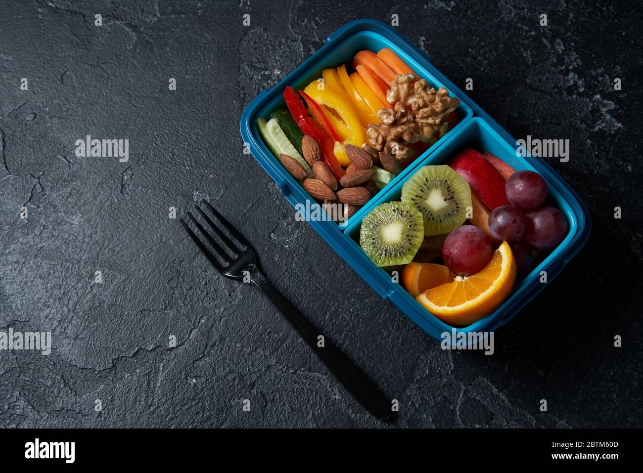 Top View of Full Lunch Box with Fuits, Vegetables and nuts. Healthy ...