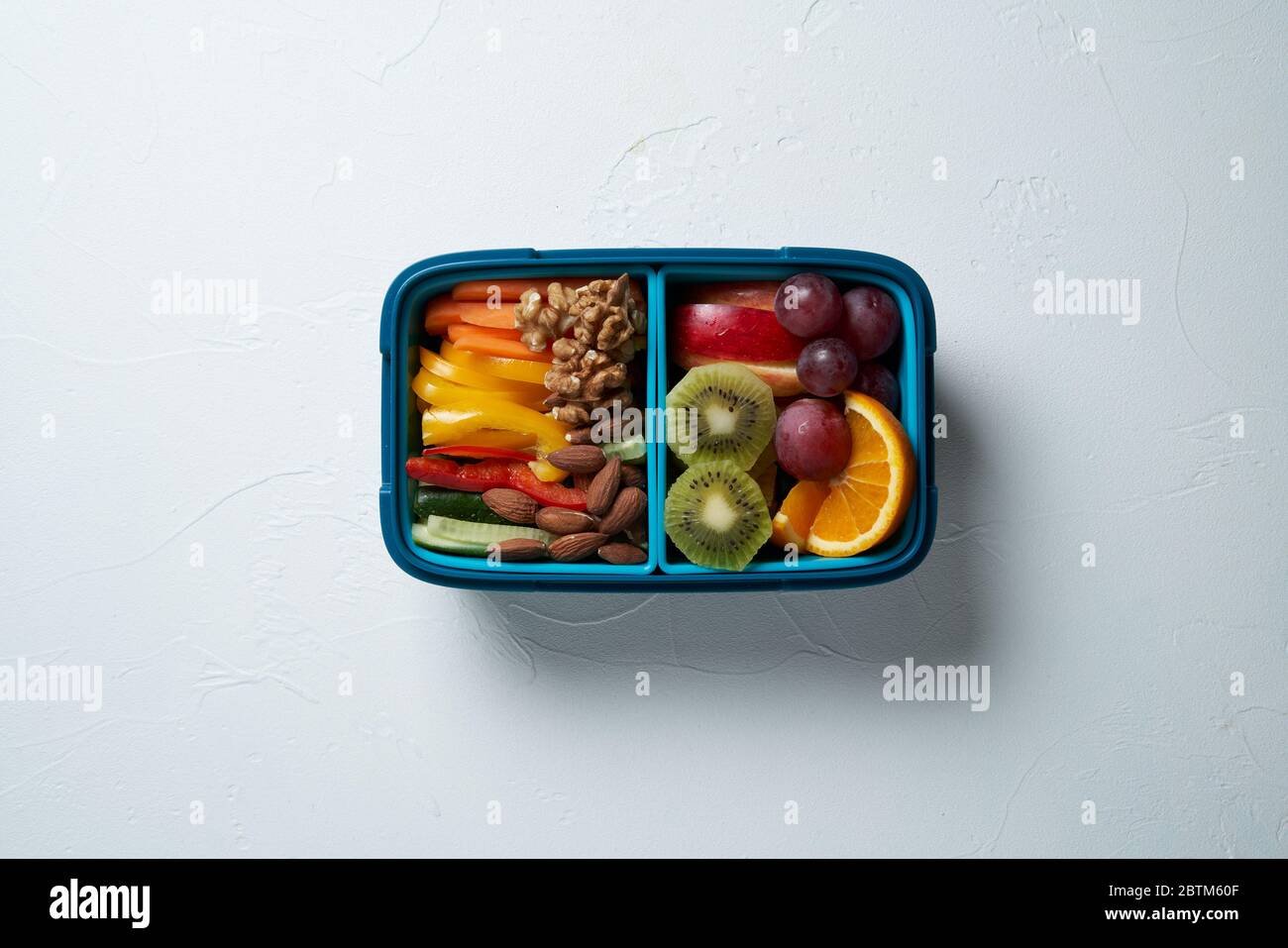 Top View of Full Lunch Box with Fuits, Vegetables and nuts. Healthy ...