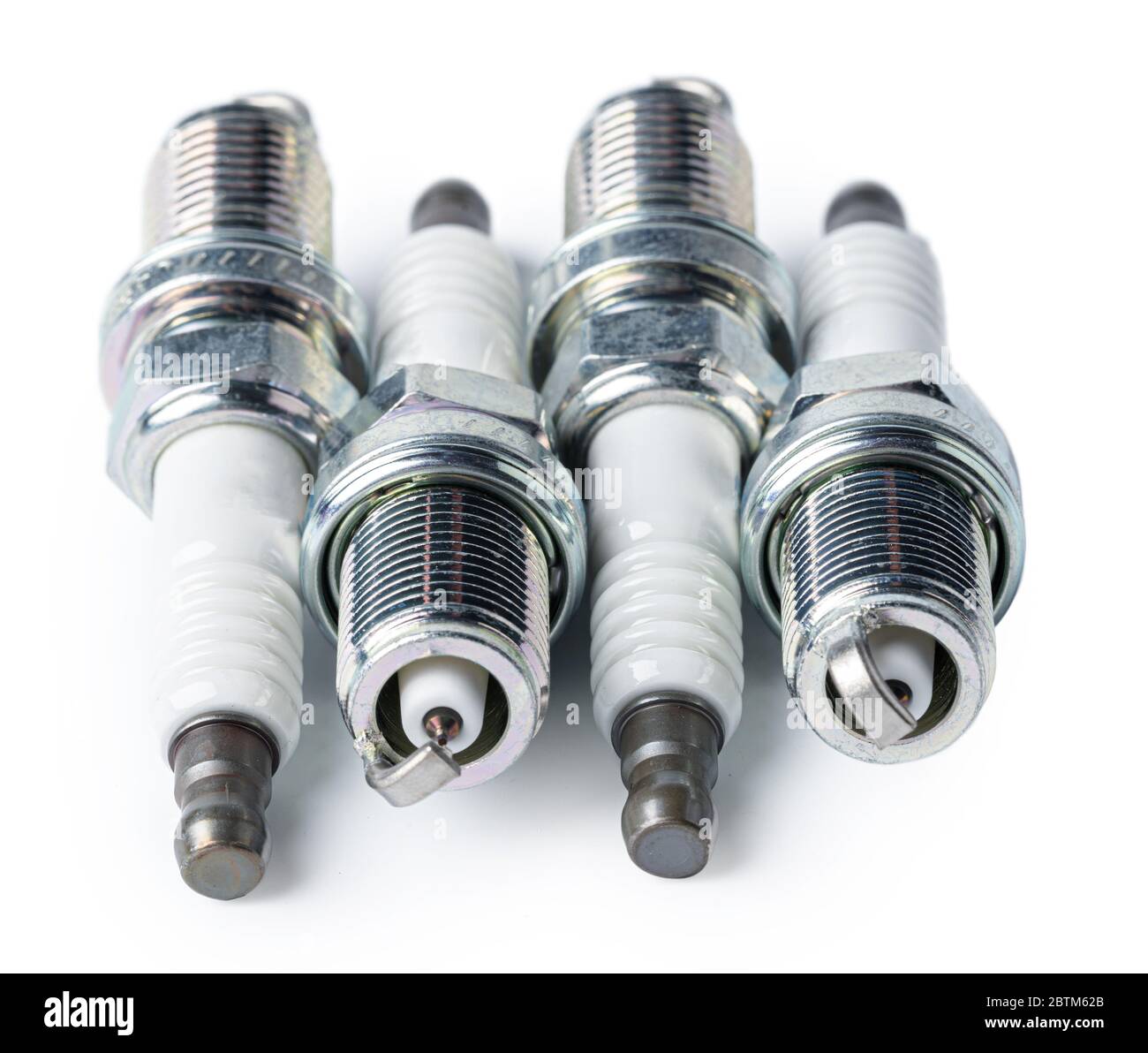 Car part. Spark plugs isolated on white Stock Photo - Alamy