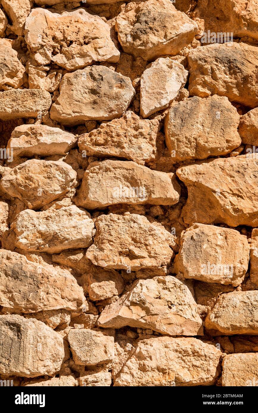 Old rustic Spanish sandstone wall made using only natural materials ...