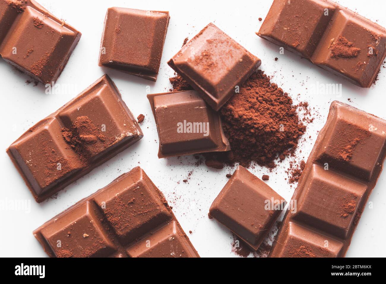 close-up shot of a few ounces of chocolate on cocoa powder. Dark ...