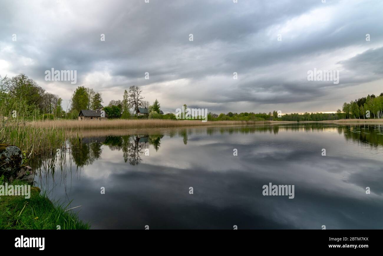 colorful spring landscape with beautiful sky, clouds and tree ...
