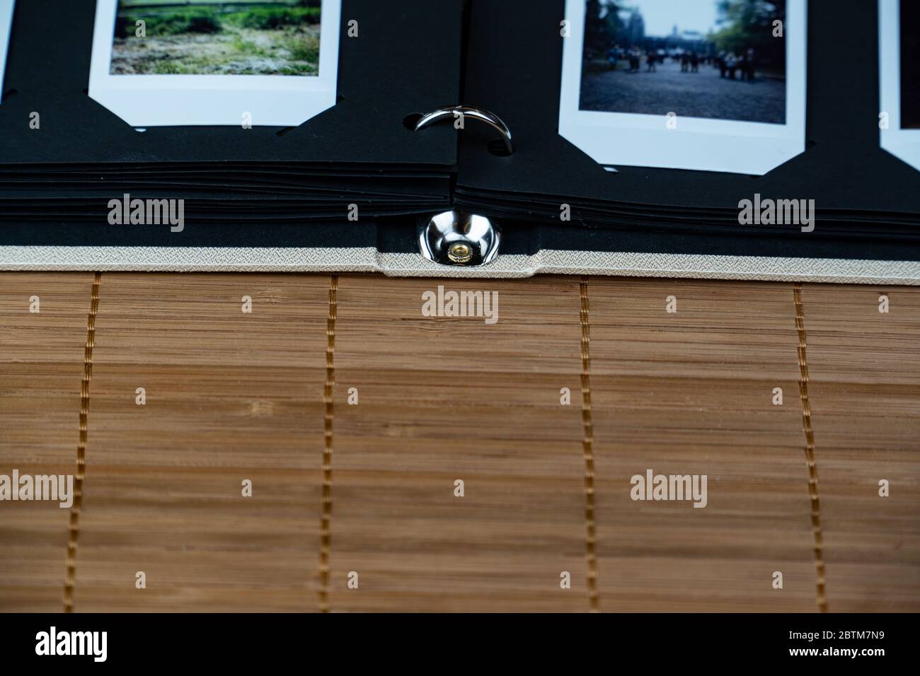 Unfolded photo album on a bamboo mat, classic black photo album Stock ...