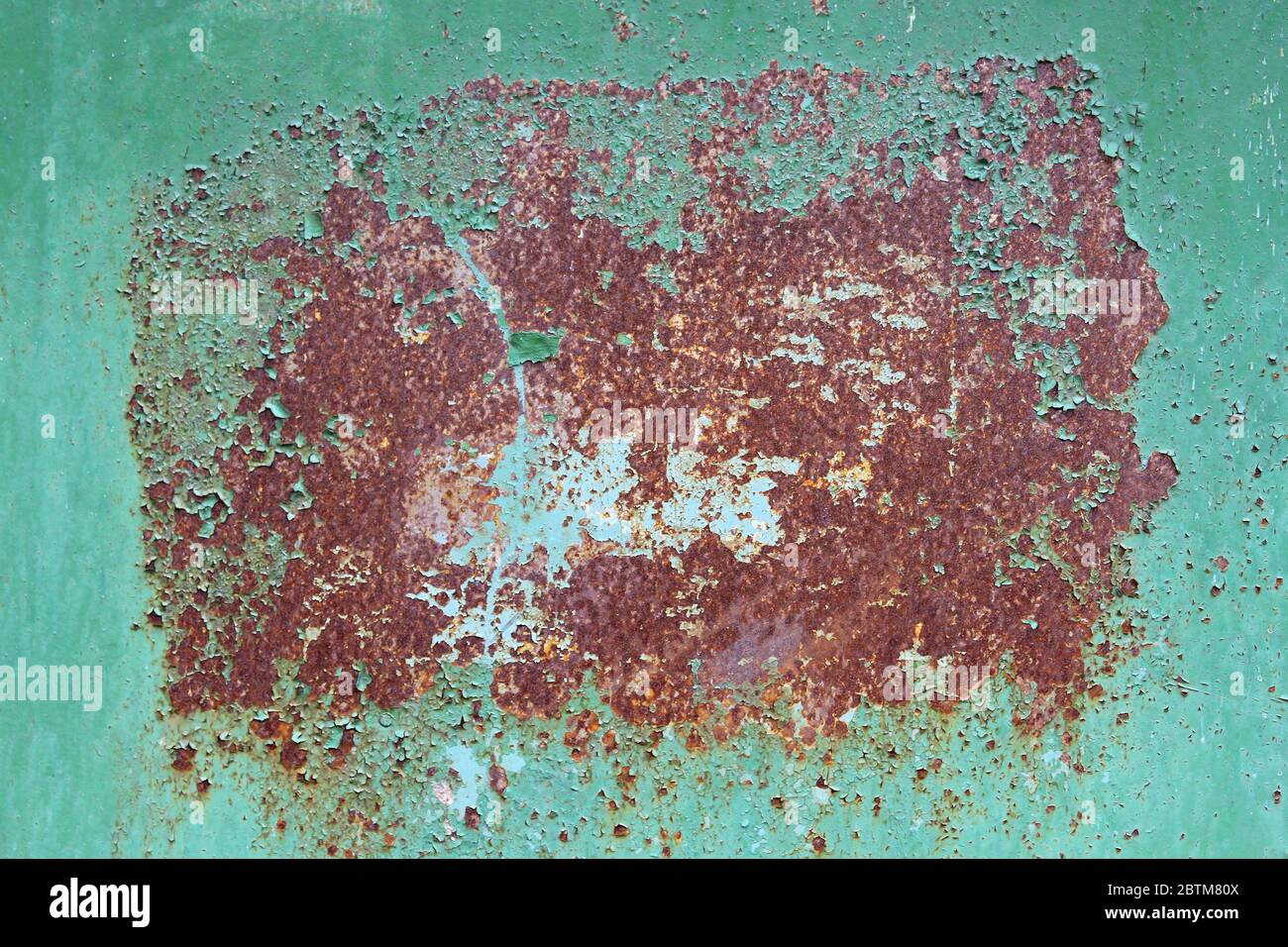 Old green iron sheet with peeling brown paint and rusty spots. Texture ...