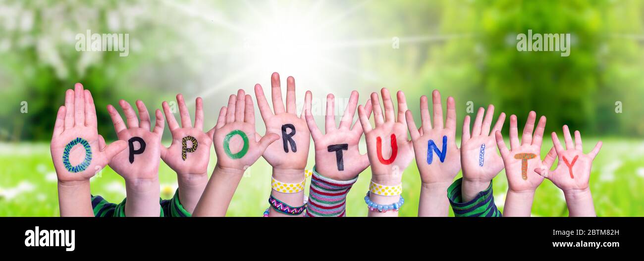 Children Hands Building Word Opportunity, Grass Meadow Stock Photo - Alamy