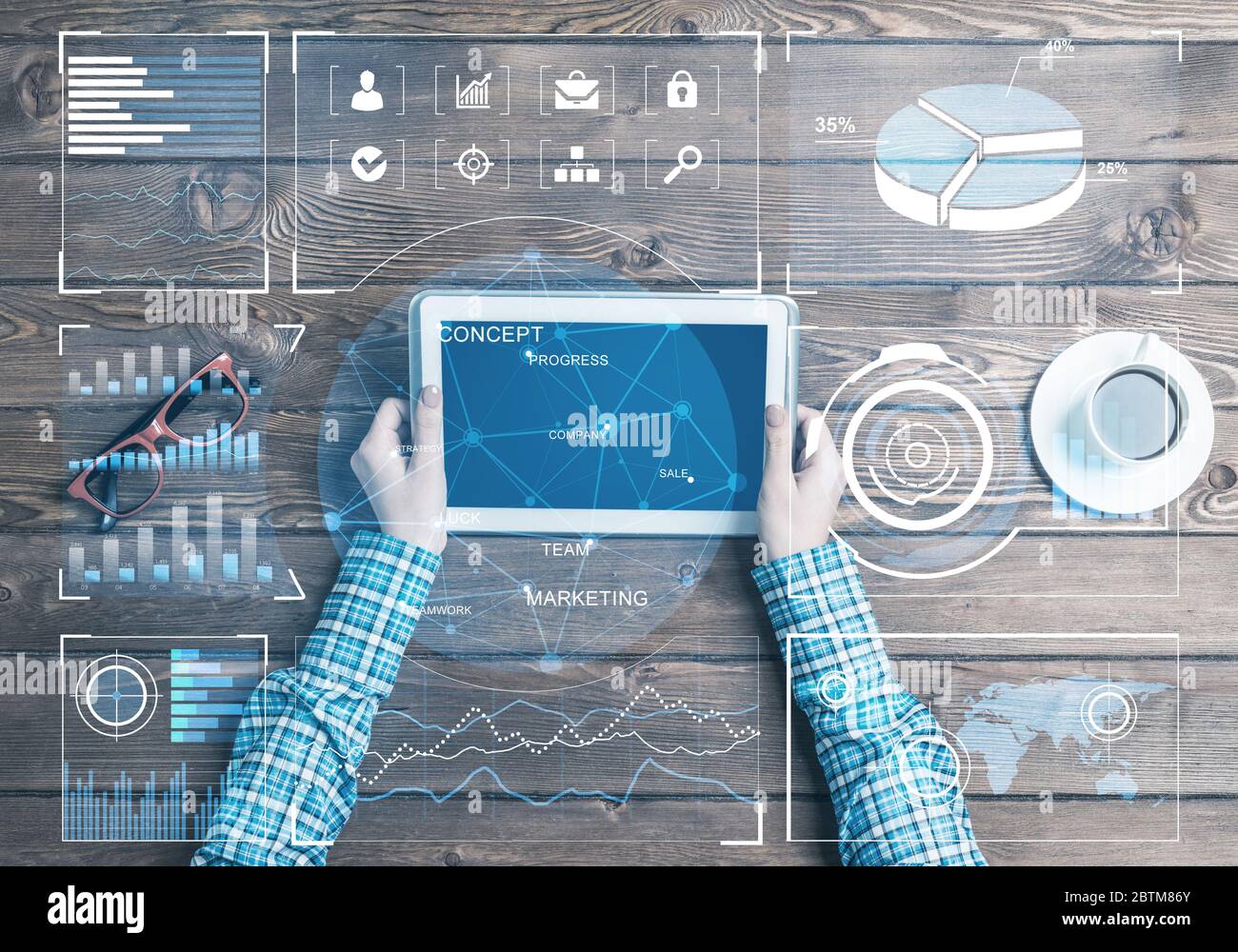 Business workplace with tablet device coffee cup and media graphs and ...