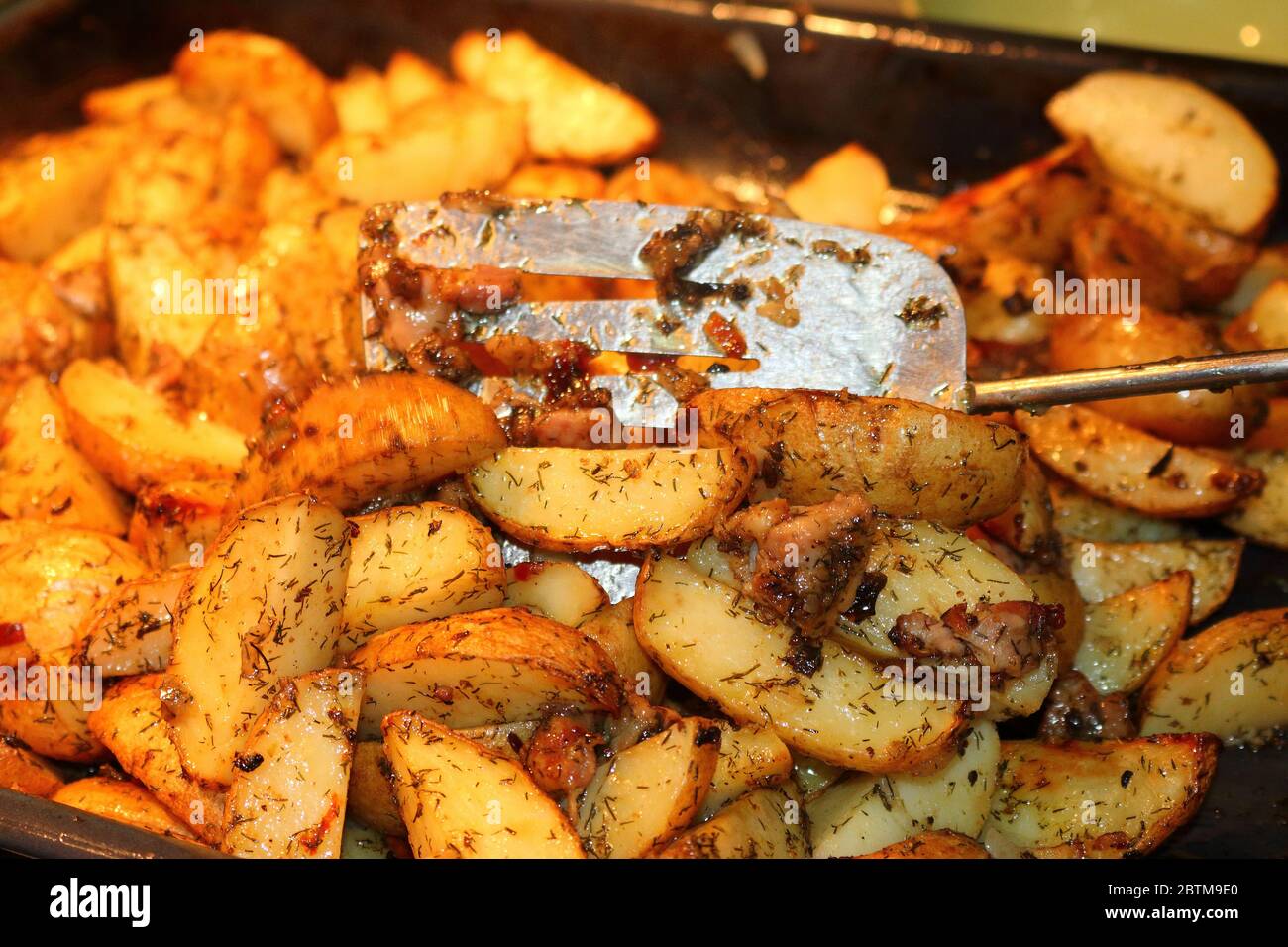 Baked potatoes with Provencal herbs Stock Photo - Alamy