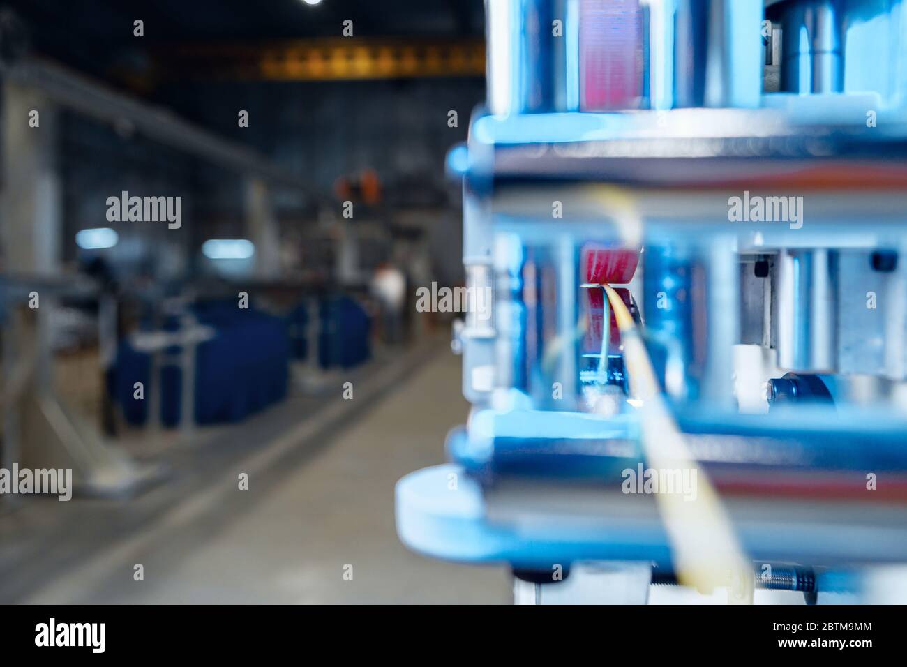 Inside a modern plant producing power electric cables and optical ...