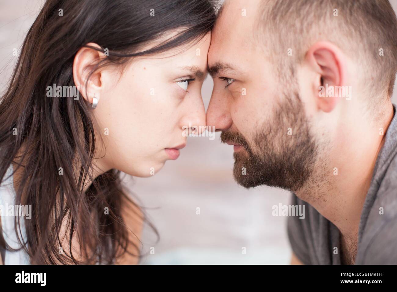 Close up of husband and wife looking into each other eyes in the ...