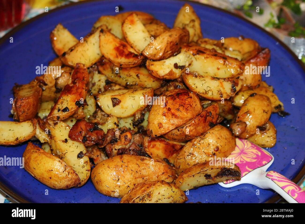 Baked potatoes with Provencal herbs Stock Photo - Alamy