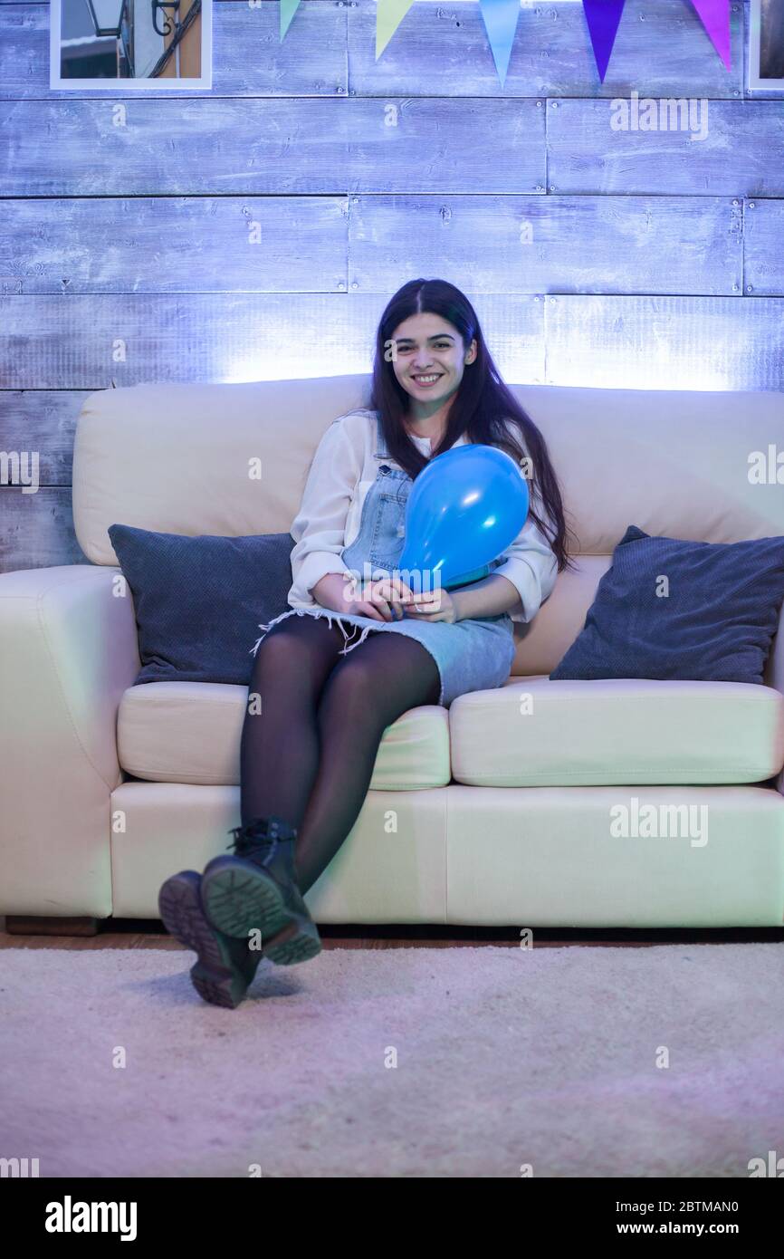 Pretty young woman with balloon at a party. Smiling girl Stock Photo ...