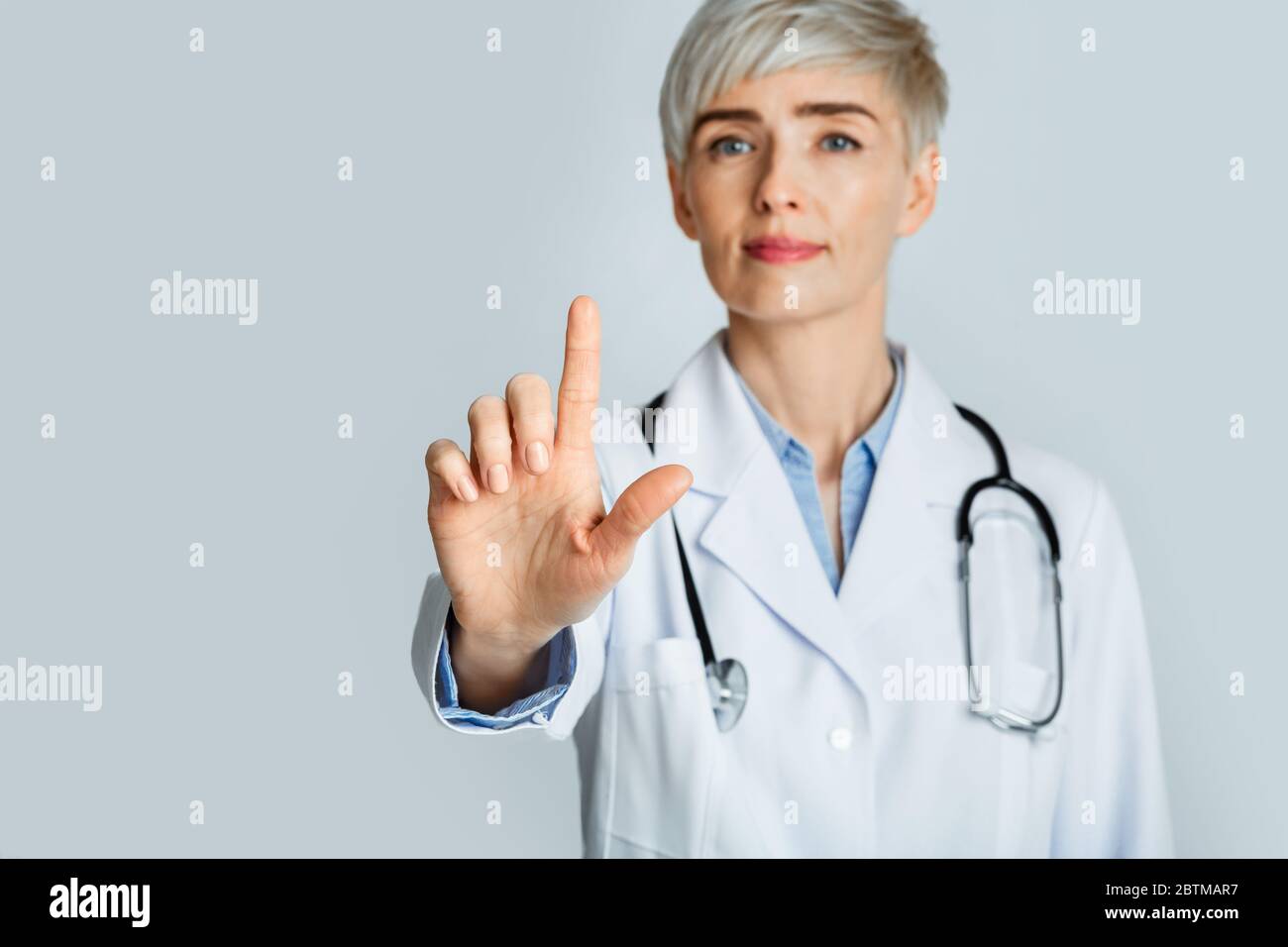 Technology for medical purposes. Doctor using invisible touchscreen and ...