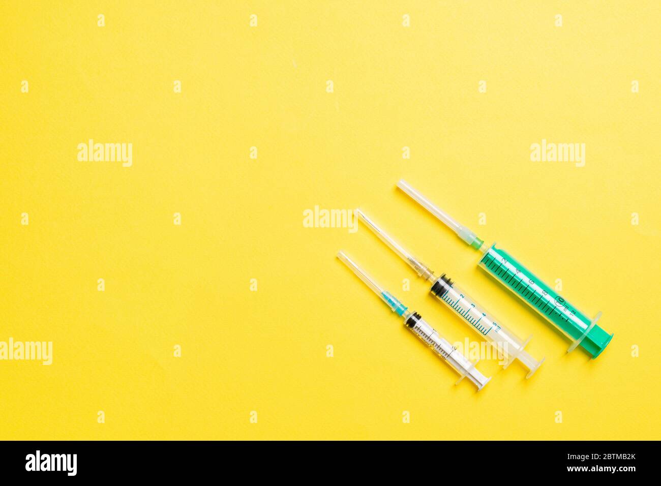 Top view of medical syringes on colorful background with copy space ...