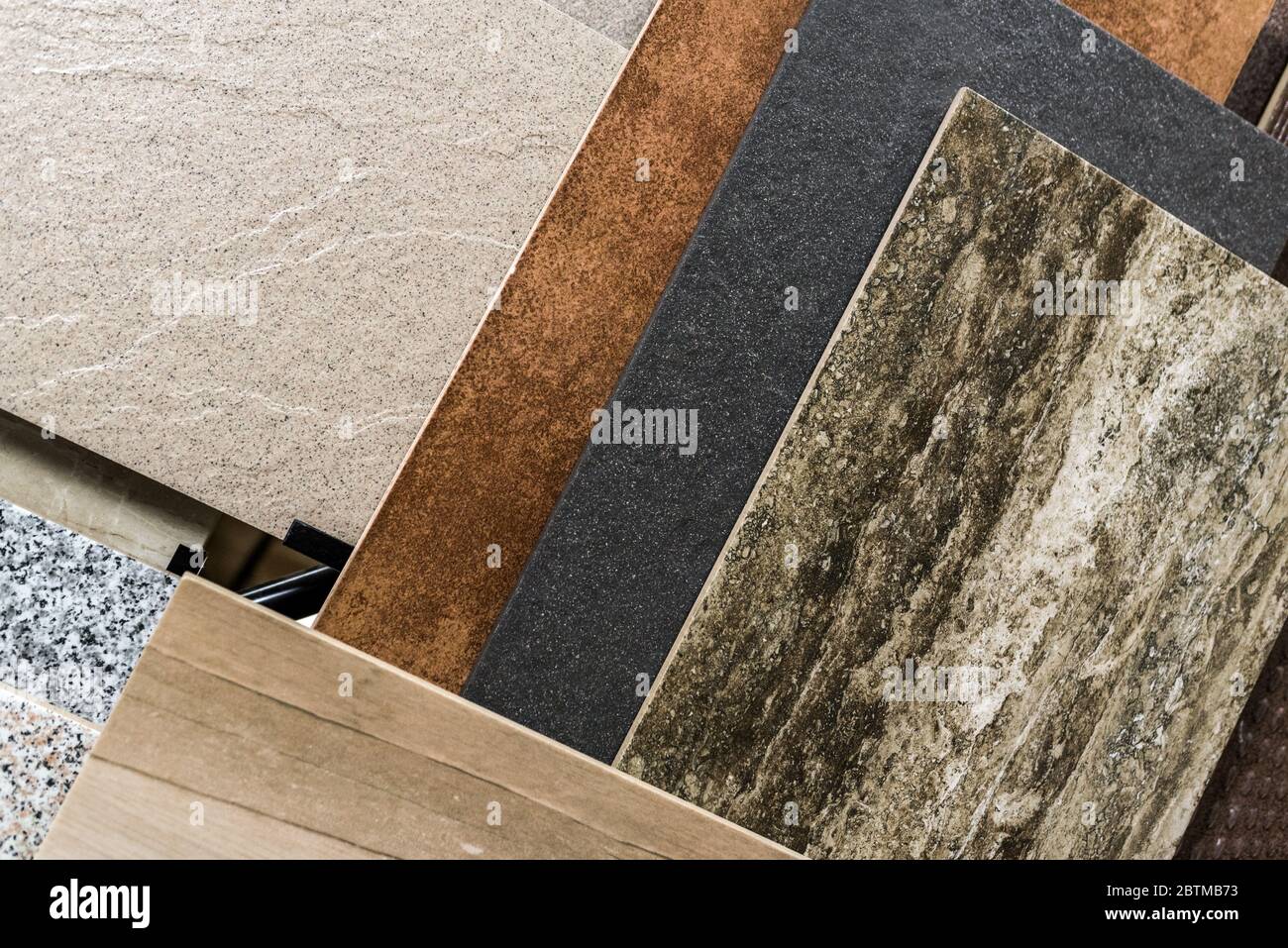 Variety of wooden like tiles. Samples of fake wood tiles for flooring ...
