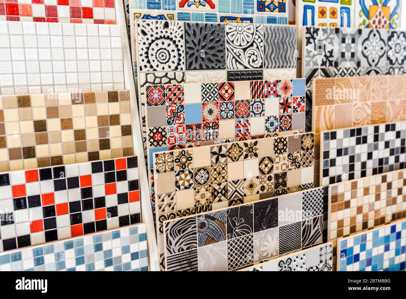 Collection of colorful tiles. Variety of tiles in an interior shop ...