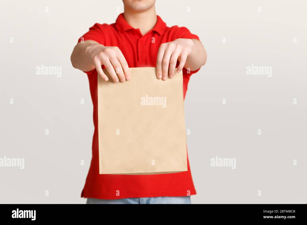 Receiving package and hand to hand delivery. courier gives package to ...