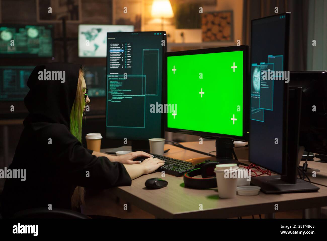 Hacker typing on futuristic computer hi-res stock photography and ...