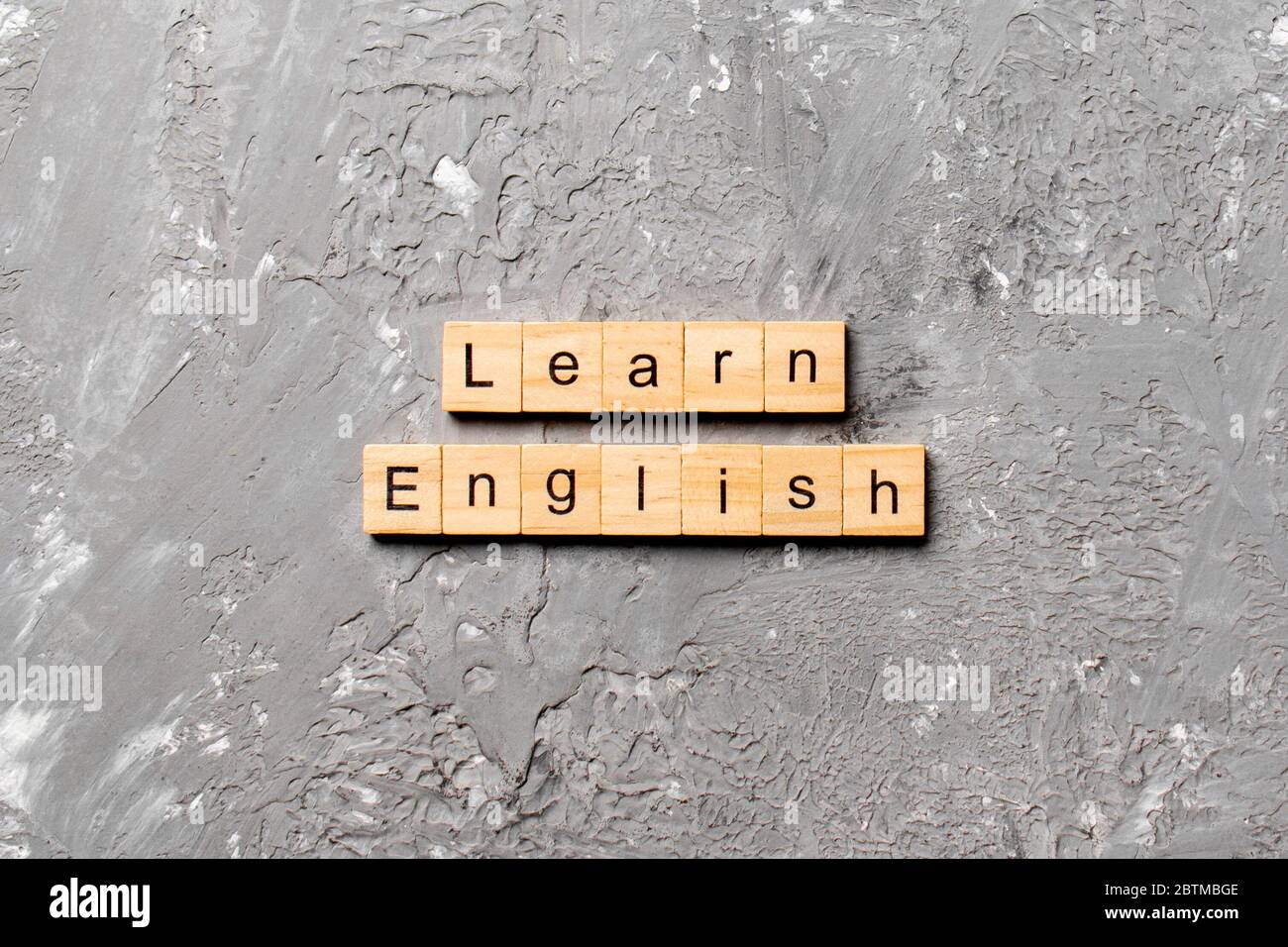 learn english word written on wood block. learn english text on table ...