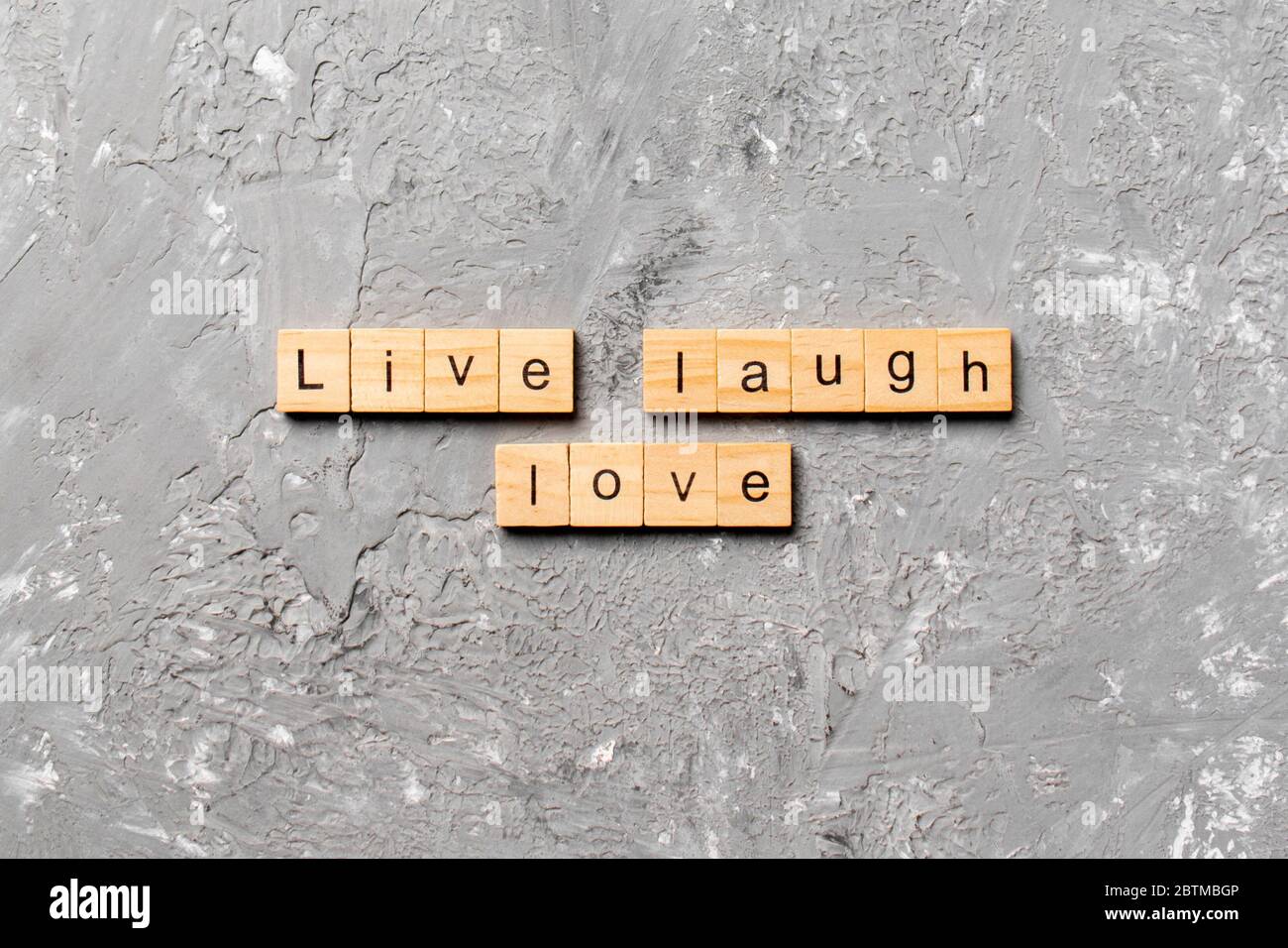 Live laugh love word written on wood block. Live laugh love text on ...