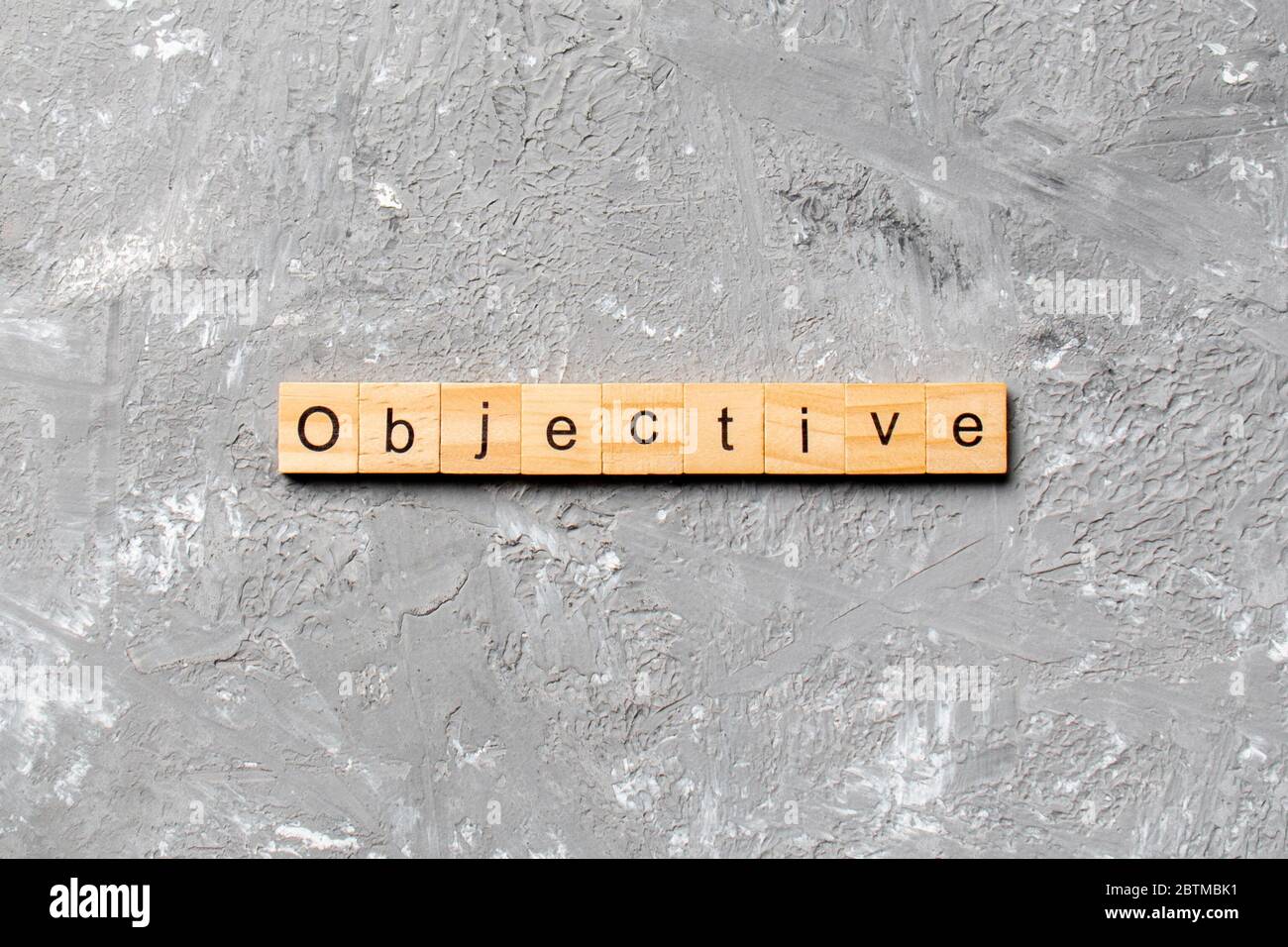 objective word written on wood block. objective text on table, concept ...