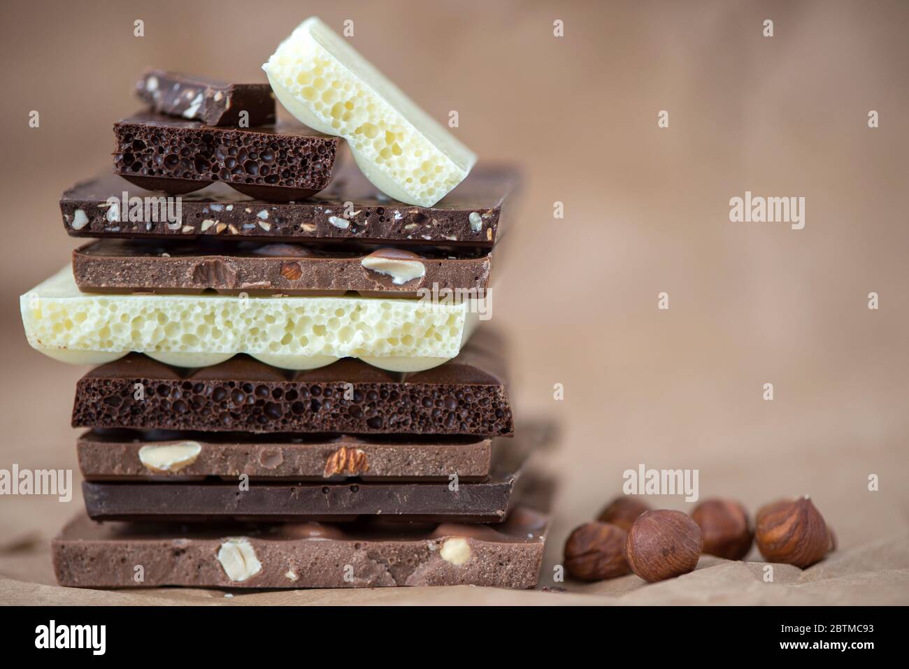 Different kinds of chocolates with nuts cocoa powder and mint ...
