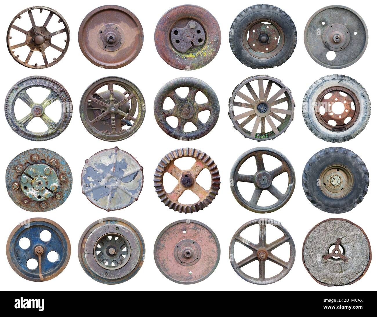 Twenty rusty metal retro wheels from an agricultural machinery ...